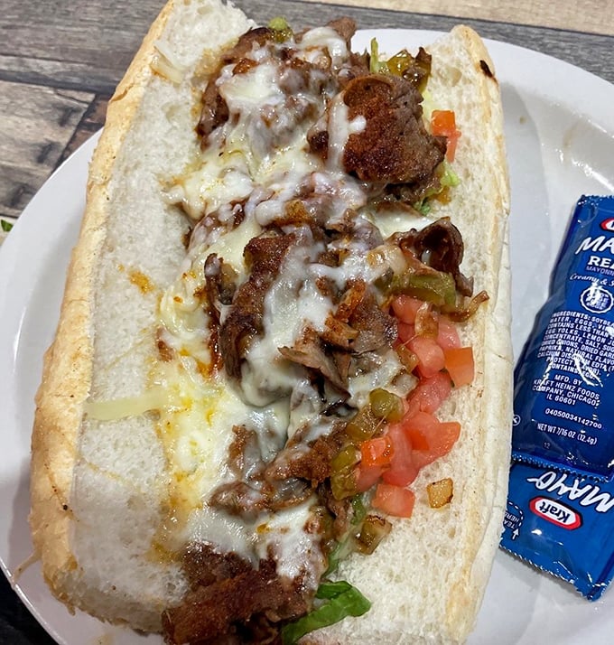 This po'boy is dressed better than most people at Sunday service&mdash;loaded with savory fillings and melty cheese that means business.