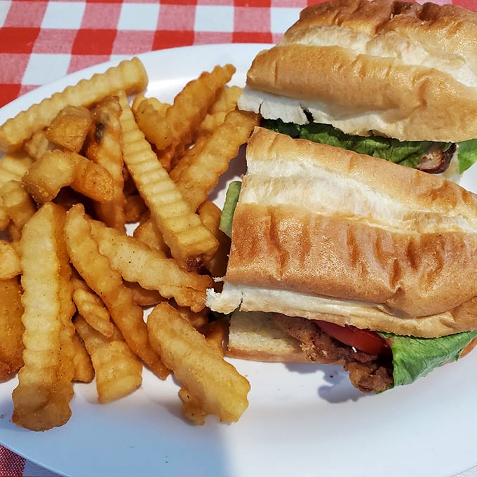 A sandwich that requires both hands and possibly a nap afterward. Those crinkle fries aren't just sides&mdash;they're supporting actors deserving their own award.