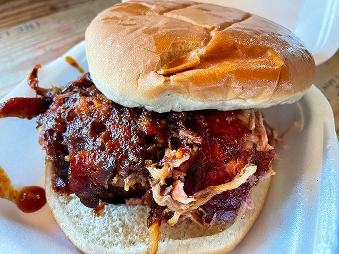 A sandwich that requires both hands and your full attention. That bark-to-meat ratio is what separates the good from the legendary.