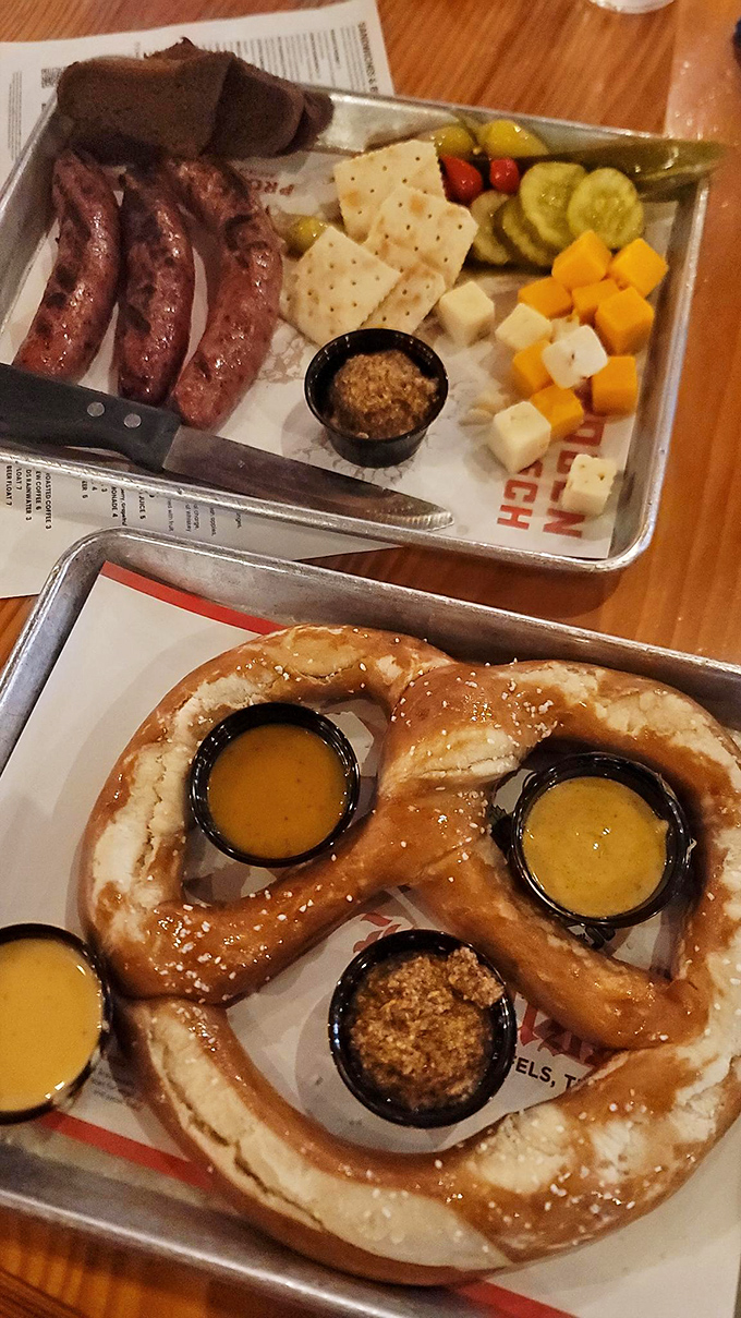 Upstairs: sausages that would make a Bavarian weep. Downstairs: a pretzel that's basically carbohydrate origami with mustard pearls.