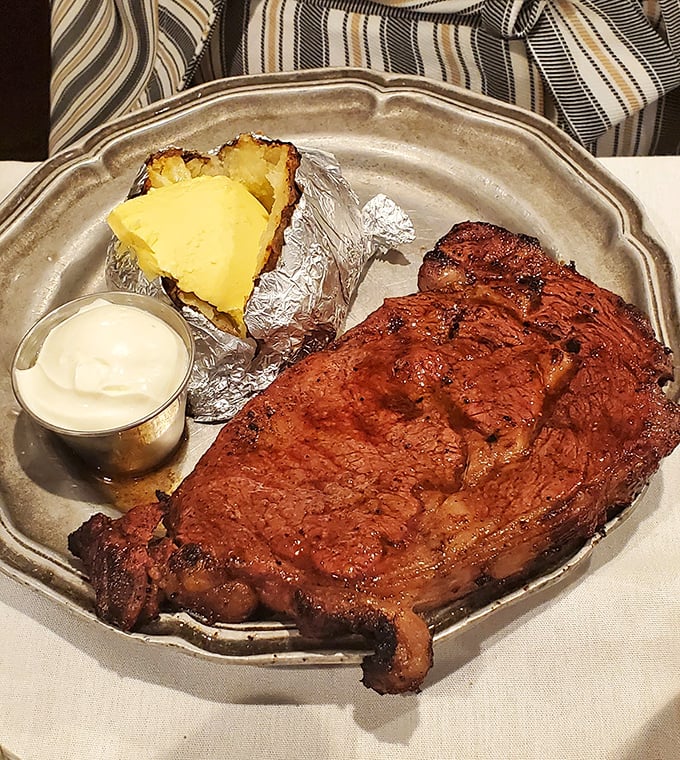 Prime rib so perfectly executed it should come with its own standing ovation. The generous pat of butter on that potato isn't excess &ndash; it's respect.