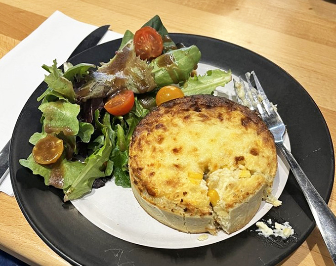 Quiche perfection that would make Julia Child weep with joy. That golden crown of cheese tells you everything you need to know.