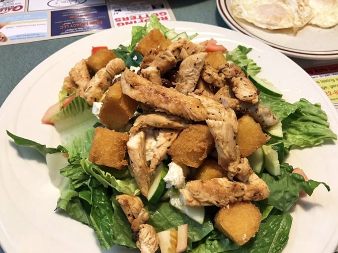 A salad that doesn't apologize for being healthy. Grilled chicken and crisp greens playing nicely with crunchy croutons&mdash;a lighter option that still satisfies.