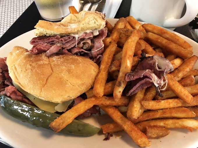 Not just a sandwich but an architectural marvel of pastrami and bread, with fries so perfect they deserve their own fan club.