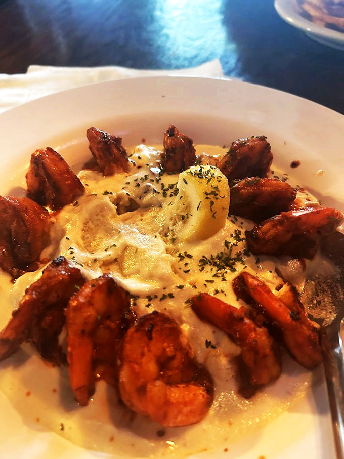 Guinness BBQ shrimp circling creamy grits like delicious sentinels. The South and Ireland found common ground, and that ground is apparently covered in savory sauce.