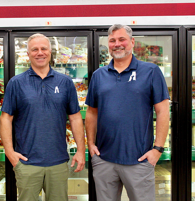 The friendly faces behind Arizona's largest grocery liquidator. Their blue polos might as well be superhero capes for budget-conscious shoppers.