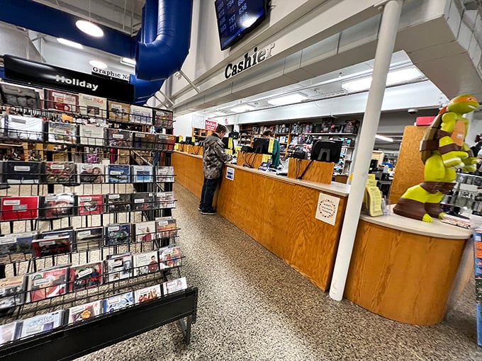 A life-sized Stormtrooper stands guard over the toy section, perhaps ensuring no one leaves without a dose of nostalgia.