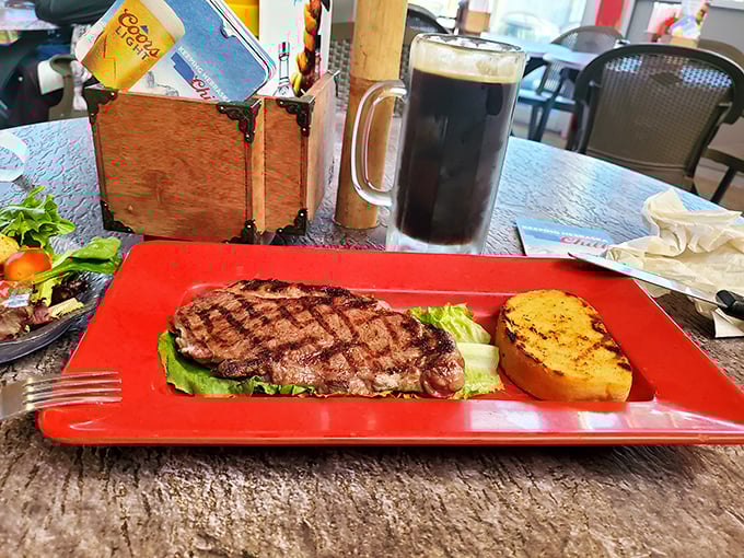 When a steak arrives on a bright red plate with Texas toast, you know you're in for a heartland feast that speaks the universal language of "yum." 