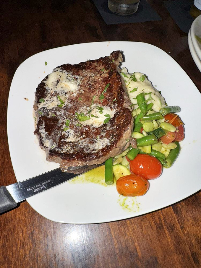 A steak that doesn't just satisfy hunger &ndash; it resolves existential crises. Those vegetables aren't sidekicks; they're co-stars in this meaty drama.