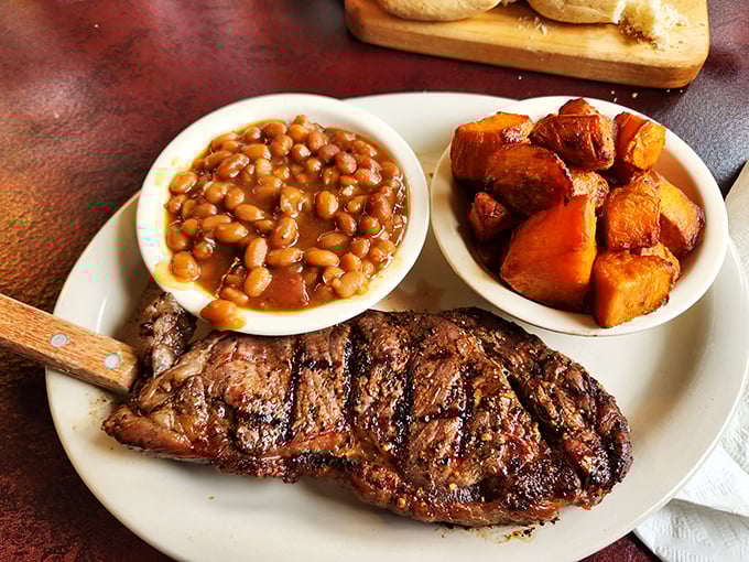 A steak that needs no introduction, accompanied by baked beans and sweet potatoes. This plate doesn't just satisfy hunger&mdash;it resolves existential crises.