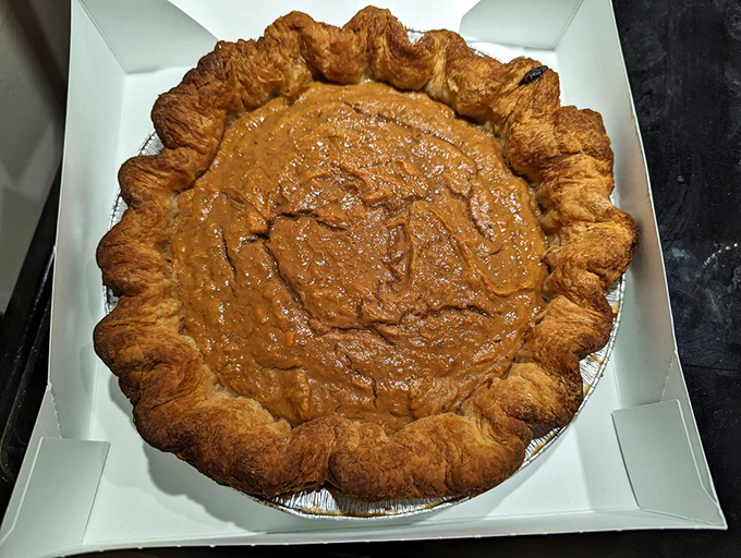 Sweet potato pie with a crust so flaky it should be illegal. The kind of dessert that makes you involuntarily close your eyes with each bite.