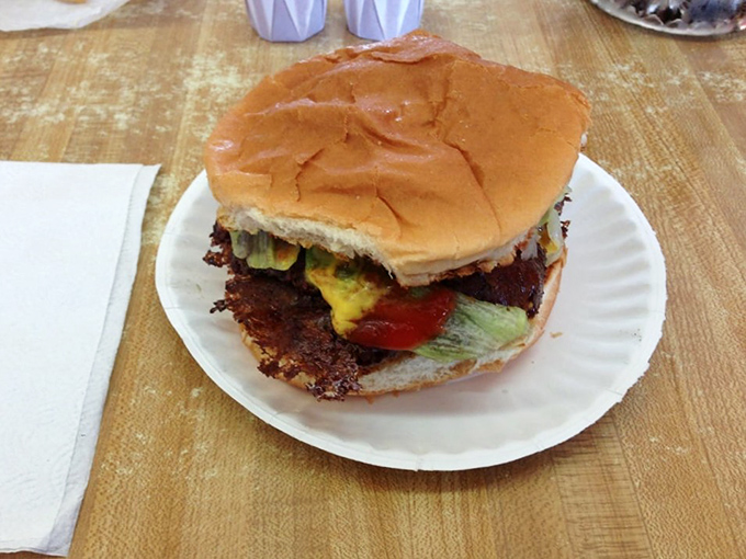 Three patties, cheese melted between each layer&mdash;this burger stack isn't just lunch, it's an engineering marvel with a side of nostalgia.