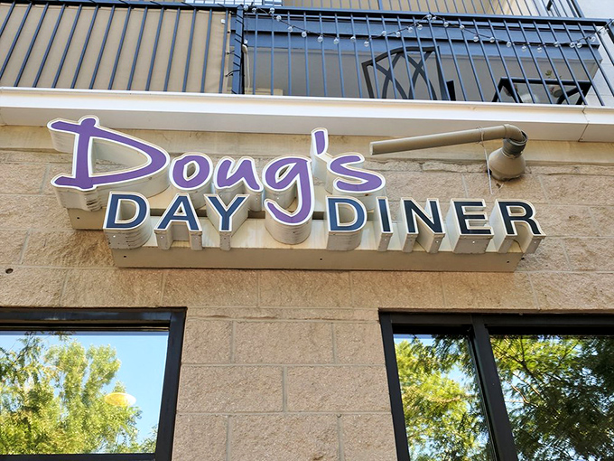 Doug's Day Diner's purple sign announces itself with the cheerful confidence of someone who knows their omelets are unbeatable.
