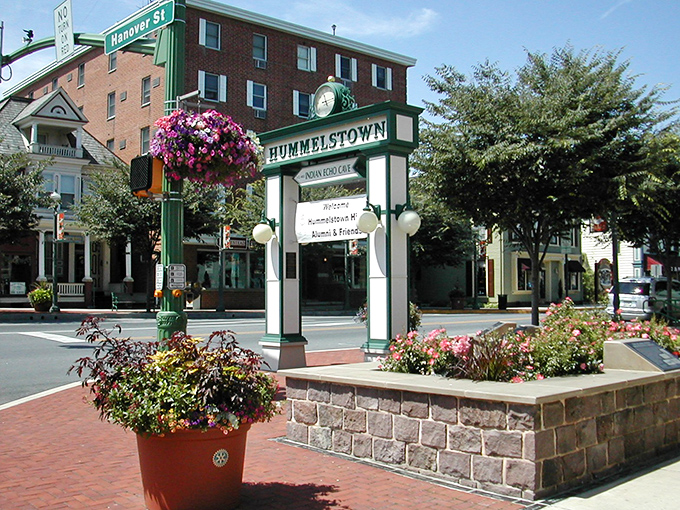 Hummelstown's welcome sign – adorned with flowers that locals definitely gossip about who waters them and when. Small-town politics at its finest!