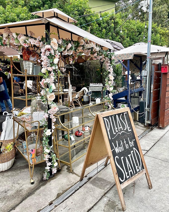 Lady Byrd Cafe's flower-adorned entrance promises a garden party where you're the guest of honor.