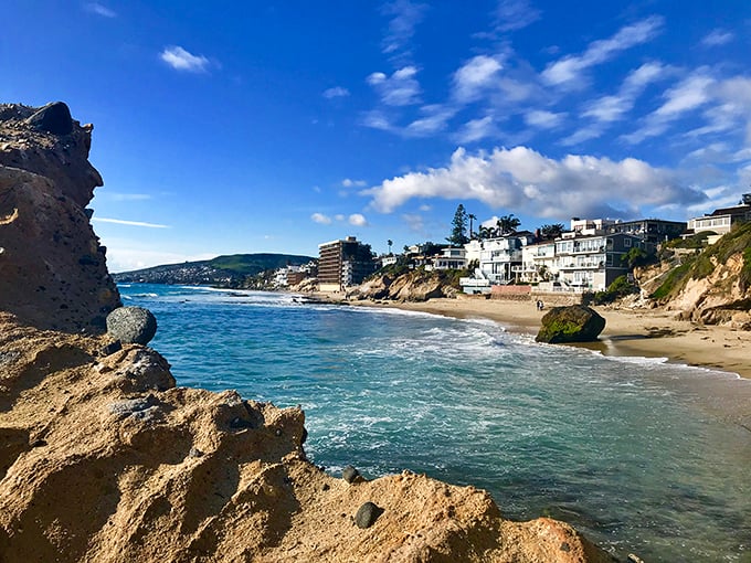 Dramatic cliffs meet crystal blue waters in this artistic haven, where even the beach rocks seem to pose artistically for your Instagram feed.