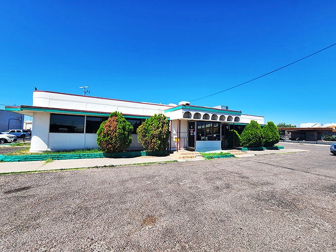 Mel's humble exterior tells the story of a diner that lets its food do the talking. Those arched windows have witnessed countless "mmms" of satisfaction.