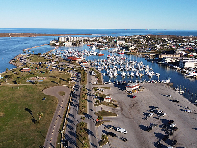Port Aransas sparkles under the sun, where boats bob lazily and coastal breezes promise a laid-back escape.