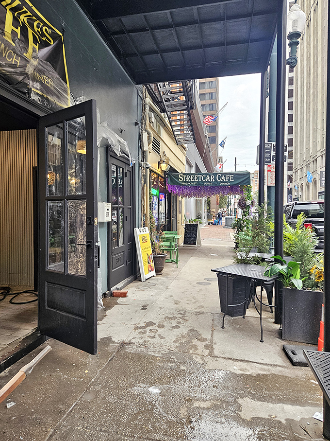 Streetcar Cafe's cozy entrance, adorned with greenery, offers a peaceful pause from the bustling New Orleans streets just steps away.