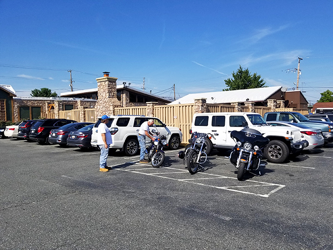 The Hickory Lodge's rustic exterior promises hearty meals and warm hospitality, with plenty of parking for both bikers and families.