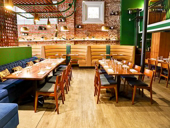 A5 Steakhouse (interior): "Green walls, golden booths, and a room designed for the serious business of forgetting all your problems through beef."