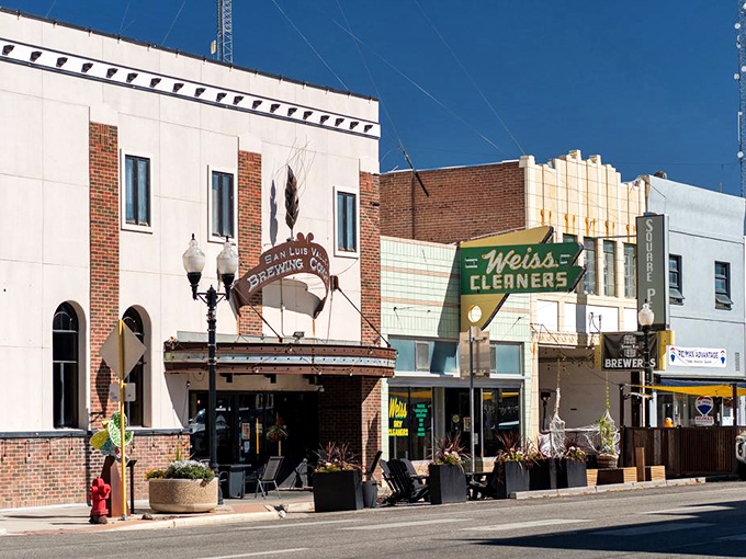 Historic buildings line Alamosa's main street, offering affordable shopping and dining options. Your Social Security check just breathed a sigh of relief!