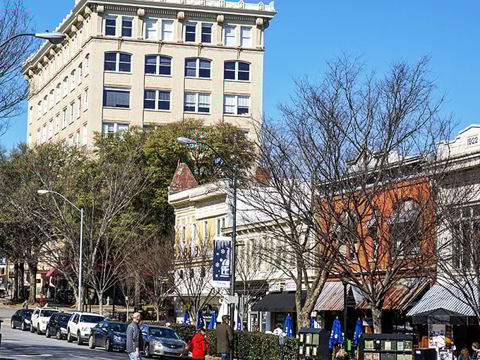 The historic Imperial Theatre in Athens glows at twilight &ndash; a beacon of affordable entertainment in a sea of rising prices.