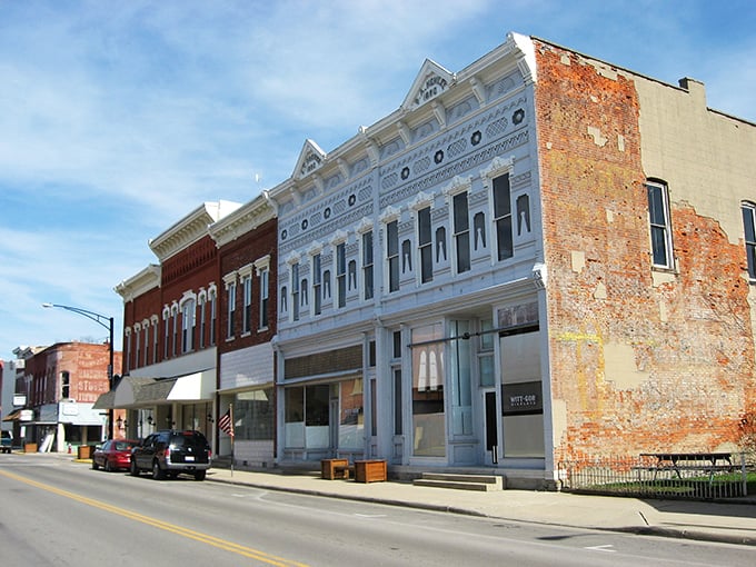 The warm brick facades of Columbus Grove create a timeless backdrop for daily life in this close-knit community.