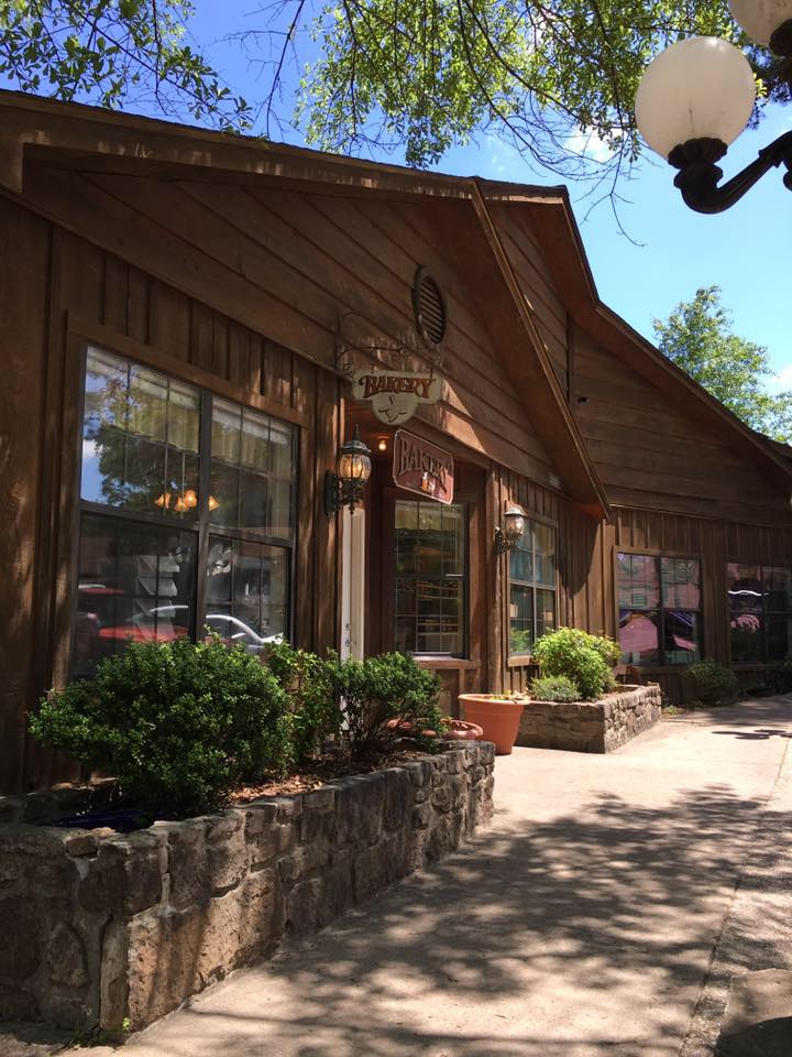 Stone planters and charming woodwork frame this bakery's entrance, where Star City's sweetest secrets have been hiding in plain sight.
