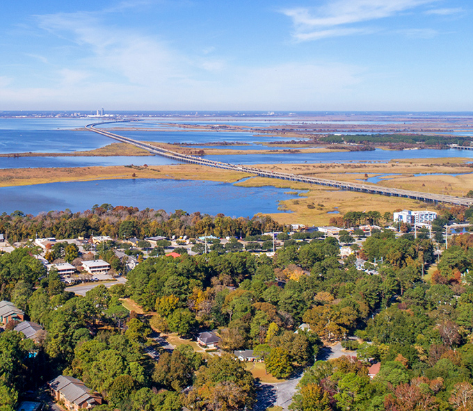 The view from Daphne stretches all the way to Mobile Bay and beyond. That causeway isn't just a road&mdash;it's your connection to everything while living away from it all.
