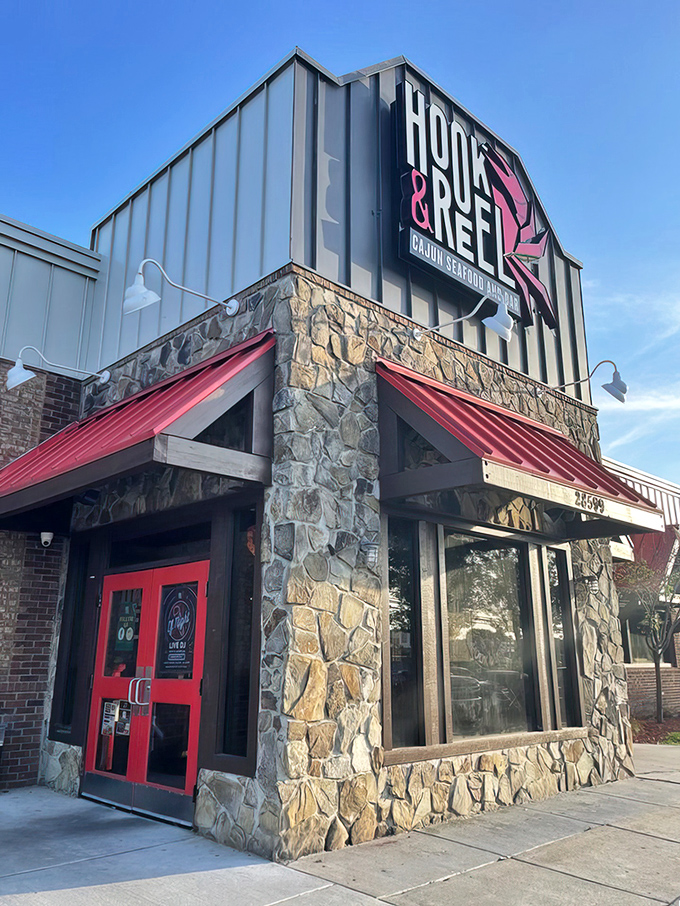 Behind those doors awaits a hands-on seafood experience where plastic bibs are fashion statements and napkins are merely suggestions.