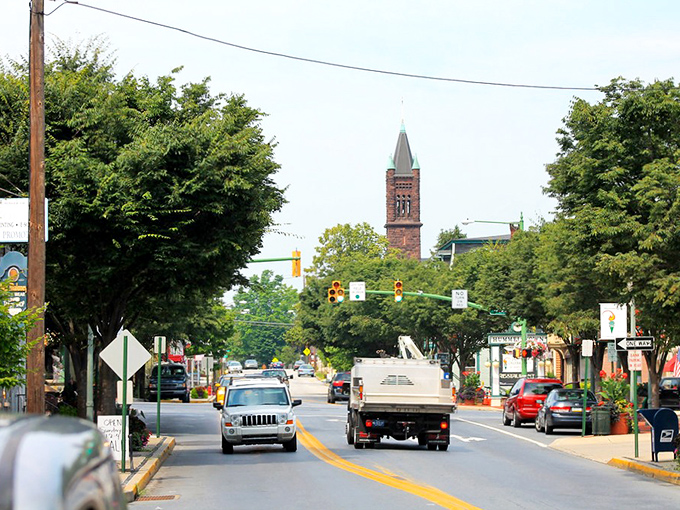 Hummelstown's tree-lined main street – where the church steeple watches over daily life like a friendly neighborhood sentinel.
