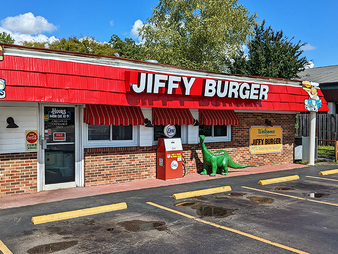 Retro vibes and prehistoric pals! Jiffy Burger's bright red exterior signals burger joy ahead in Manchester.