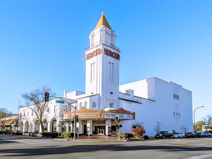 The historic Merced Theatre's distinctive tower stands tall against the blue sky, a landmark in a town where retirement dollars stretch further.