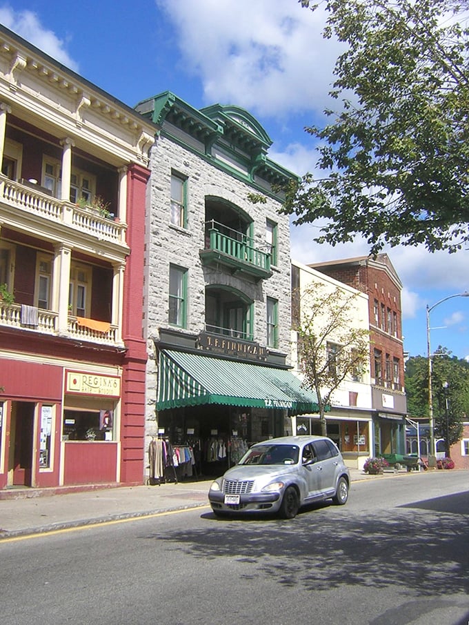 The stunning reflection of mountains in Saranac Lake creates nature's perfect mirror - selfie opportunities that actually deserve the term "breathtaking."