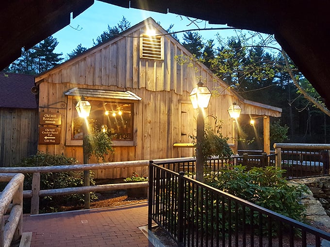 Rustic mill charm glowing against twilight sky - where colonial history and contemporary steaks create magical dinner theater.