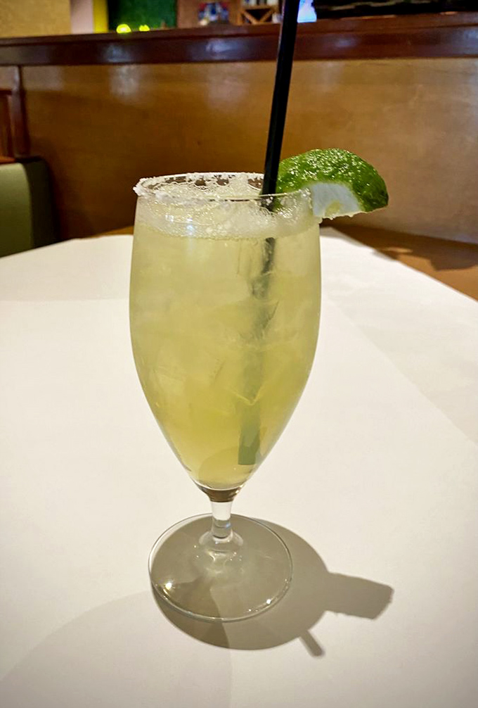 This isn't just a margarita&mdash;it's vacation in a glass. Salt rim, lime wedge, and just enough tequila to make you forget Monday exists.