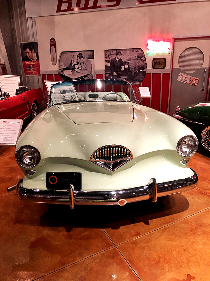 The mint-green Kaiser Darrin with its distinctive sliding doors looks like something from an alternate 1950s where Buck Rogers designed family cars.