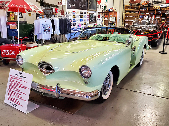 The mint-green 1954 Kaiser Darrin sports America's first fiberglass body and pocket doors that slide into the fenders like automotive magic.