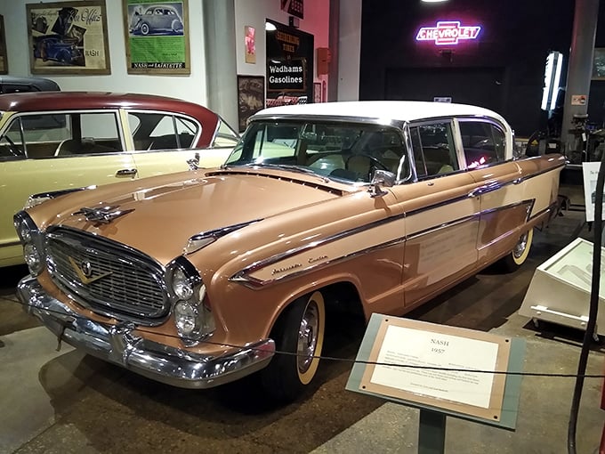 The 1957 Nash Ambassador in desert tan showcases America's mid-century optimism with enough chrome to blind astronauts and fins that suggested space travel was imminent.
