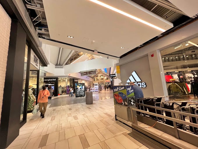 Modern, sleek corridors that whisper, "Your credit card works just fine here." The mall's architecture is as impressive as the sales inside.