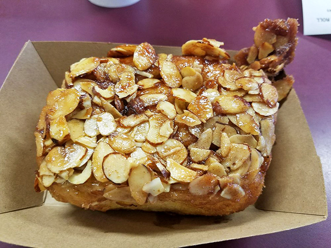 The almond roll doesn't just have toppings&mdash;it has a crown. Those toasted slivers create a nutty armor protecting the soft treasure beneath.