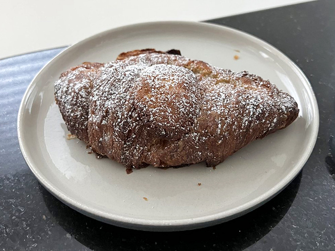 The almond croissant wears its powdered sugar like a celebrity wears designer clothes – with effortless elegance that makes you want to be friends.
