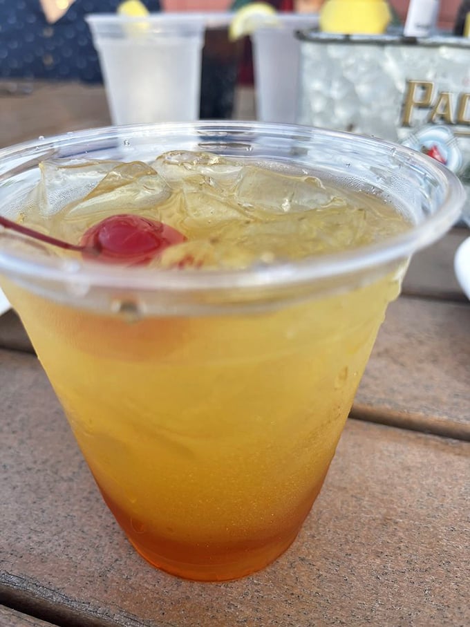 A proper waterside meal deserves a proper cocktail. This amber concoction with its cherry garnish promises refreshment after a day on the Intracoastal.