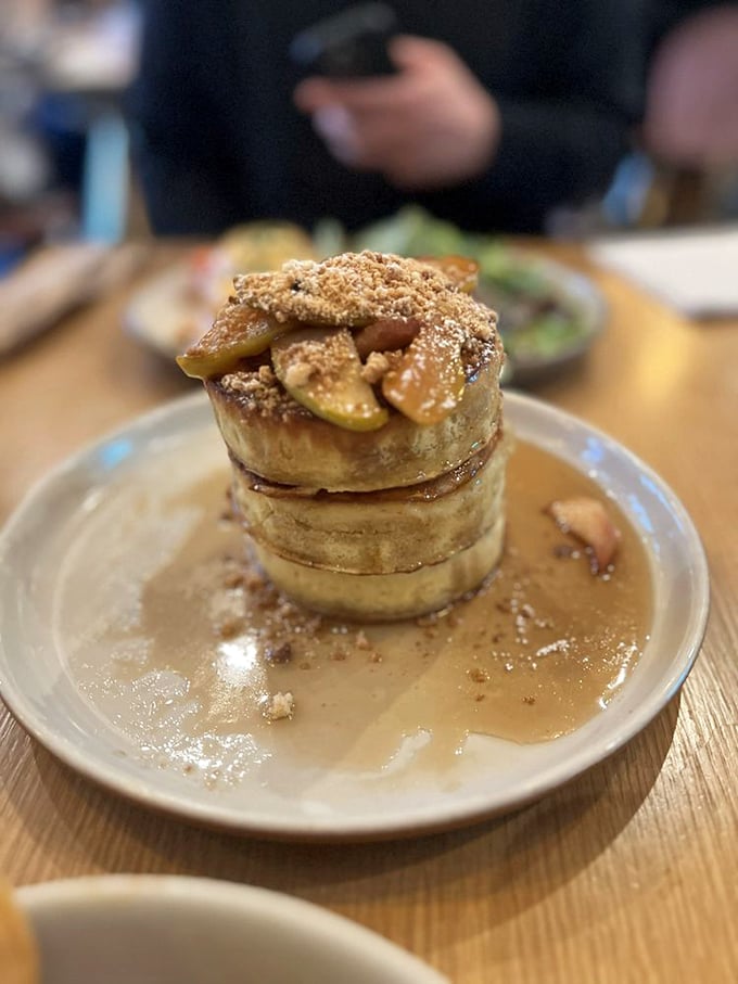 Stacked pancakes swimming in caramel sauce&mdash;proof that sometimes the best breakfast is actually dessert wearing morning clothes.