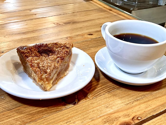 The classic pairing that never fails: a slice of cinnamon-kissed apple pie alongside coffee black enough to balance the sweetness.
