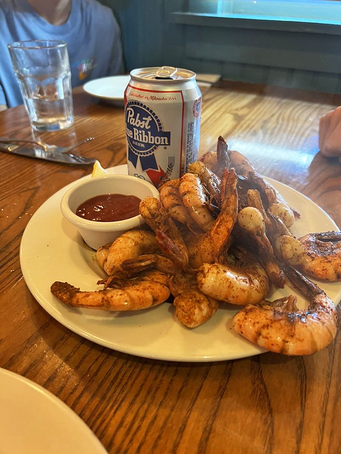Beer can shrimp served alongside an actual beer can&mdash;like getting a wink from the chef saying, "Yes, we're serious about fun."