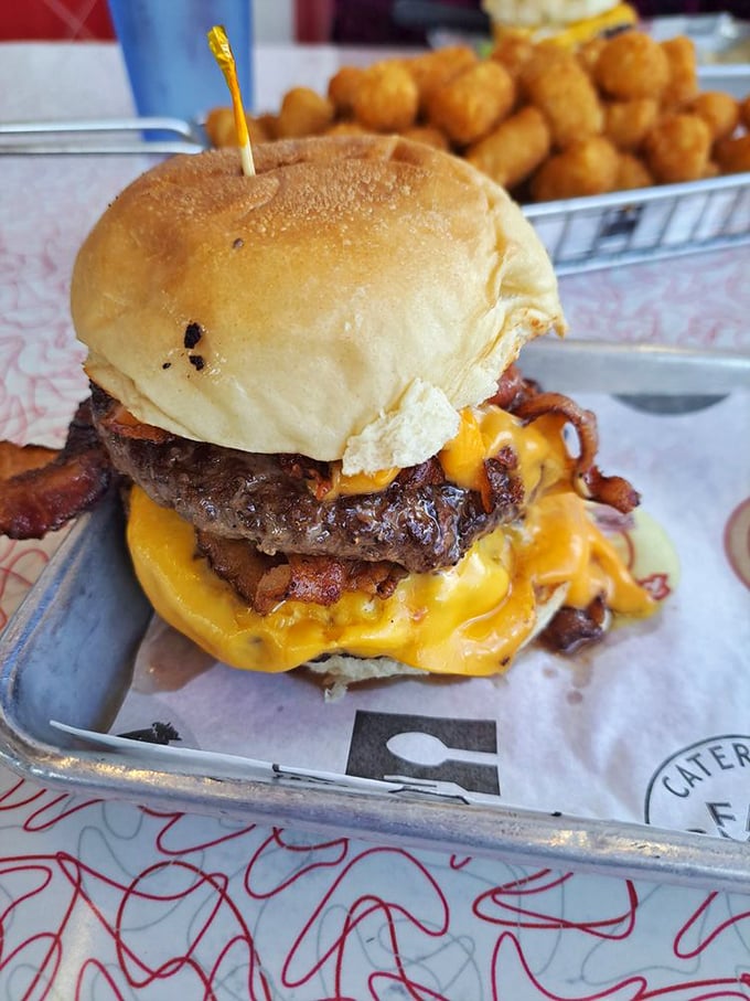 When cheese cascades over beef like a golden waterfall, you know you've made the right life choices. Those tots are the supporting actors who steal the scene.