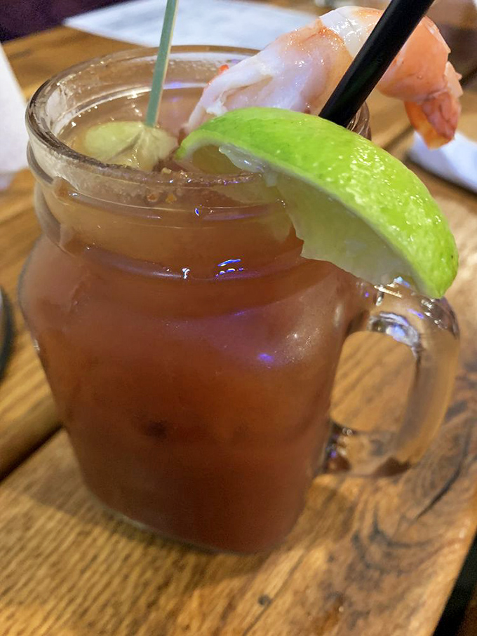 Their signature cocktail comes with a shrimp garnish—because in a seafood restaurant, even your drink deserves an appetizer.