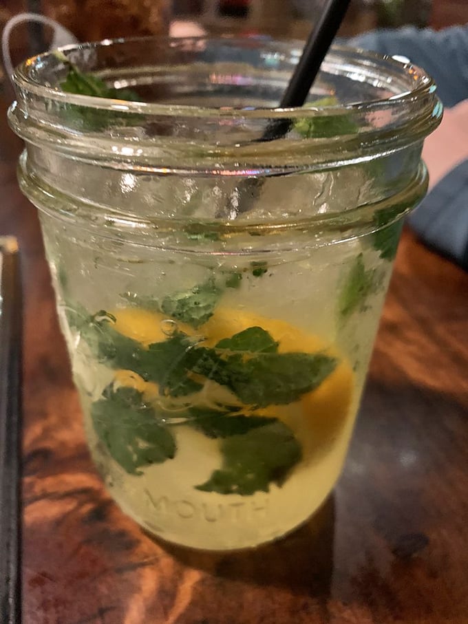 This isn't just a drink—it's a palate cleanser between bites of smoky goodness, complete with fresh herbs for that touch of sophistication.